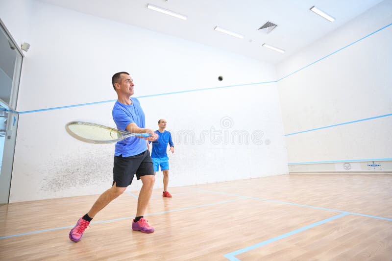 Active Men Working Out Engaging in Friendly Squash Matches Stock Photo ...