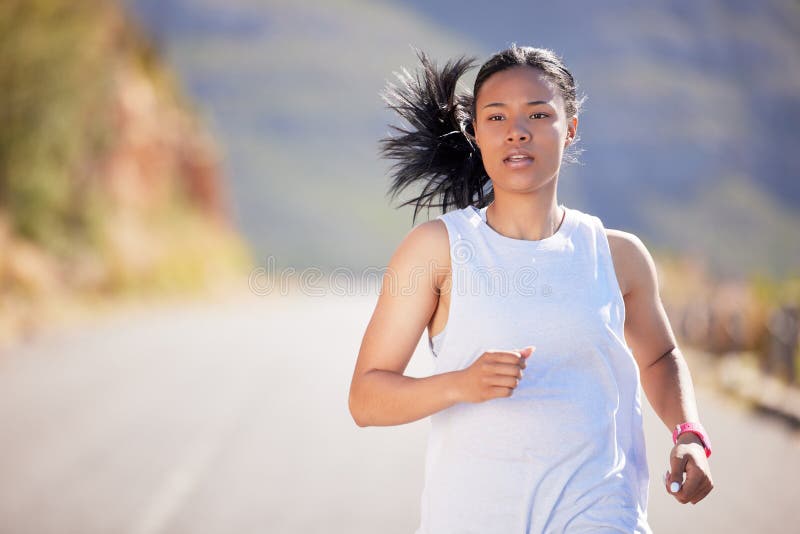 Active Mixed Race Young Woman Running for Exercise Outdoors. Athlete ...