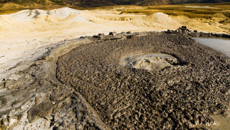 Active mud volcano river stock image. Image of mound - 38692749