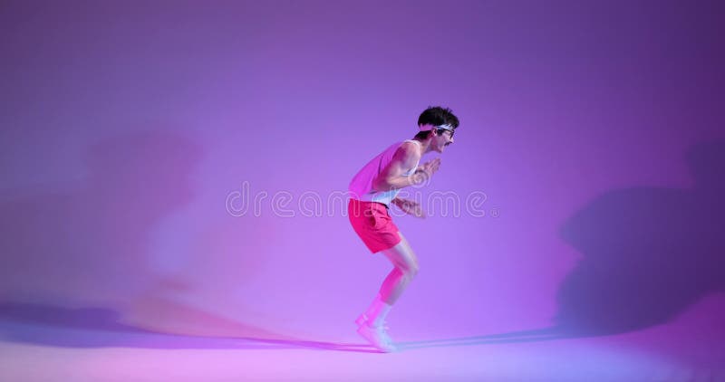 Mustached Man Playfully Jogging on Purple Background Stock Footage ...