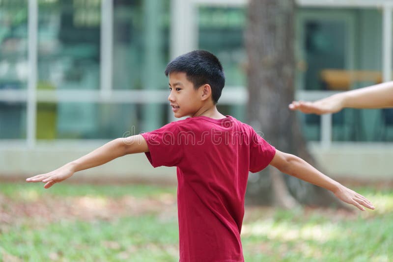 Active Play and Movement. a Boy Practices Balance and Stretches during ...