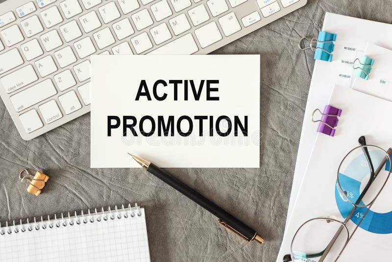 Active Promotion is Written in a Document on the Office Desk Stock ...