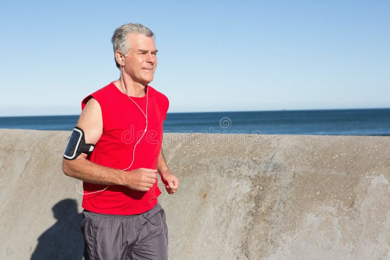 Active Senior Man Jogging on the Pier Stock Photo - Image of caucasian ...