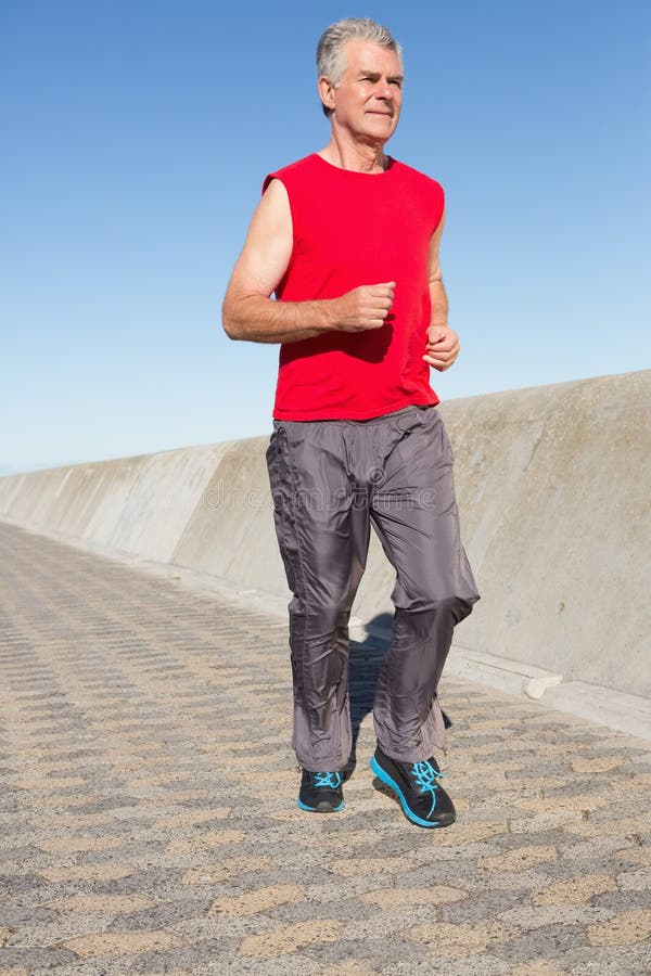 Active Senior Man Jogging on the Pier Stock Image - Image of senior ...