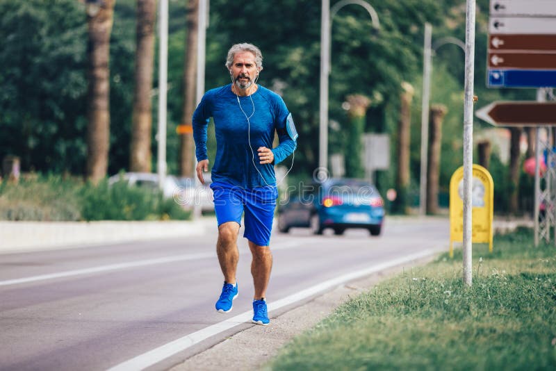 Senior Man Jogging on a Sunny Day Stock Image - Image of jogger, alone ...
