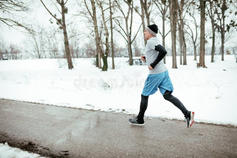 Winter Jogging stock photo. Image of horizontal, serious - 112041750