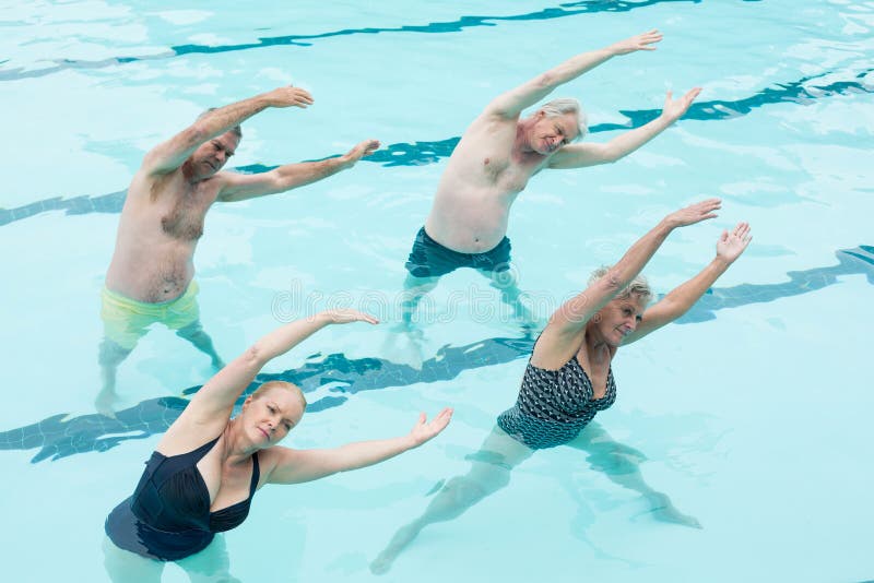 Active Seniors Exercising in Swimming Pool Stock Image - Image of ...