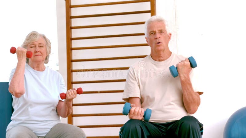Active Seniors Lifting Hand Weights Stock Footage - Video of exercising ...