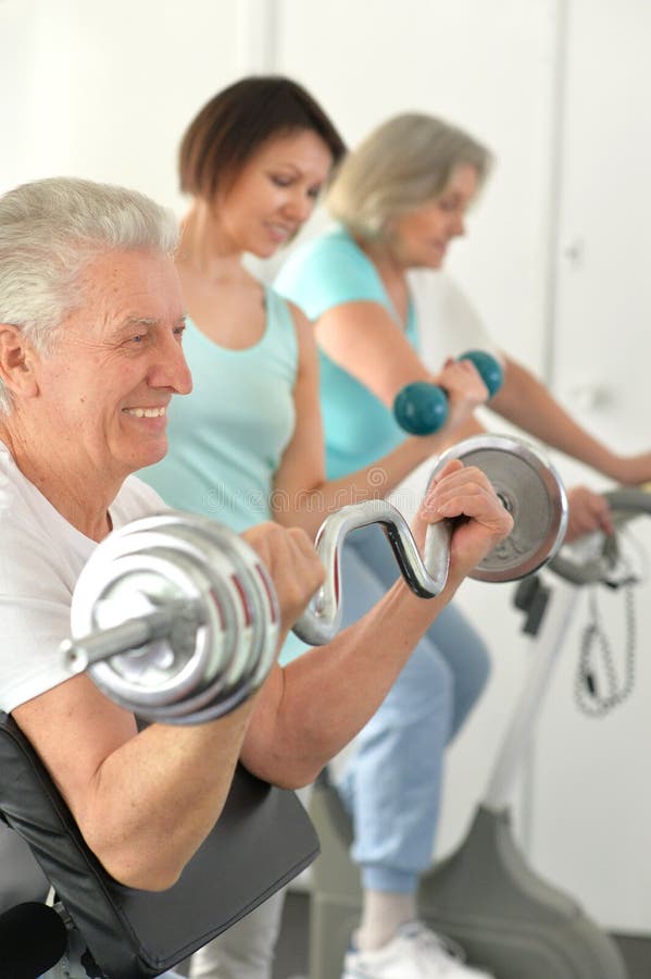 Active Smiling People Exercising in Gym Stock Image - Image of healthy ...