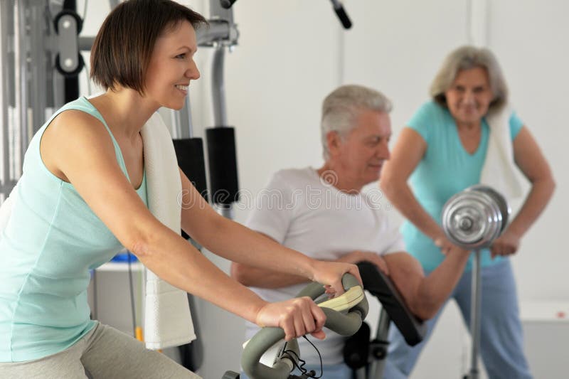 Portrait of Active Smiling People Exercising in Gym Stock Image - Image ...