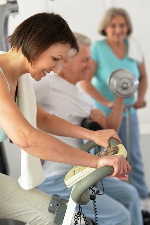 Portrait of Active Smiling People Exercising in Gym Stock Image - Image ...