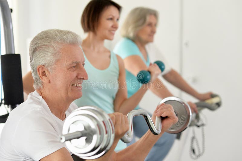Portrait of Active Smiling People Exercising in Gym Stock Image - Image ...