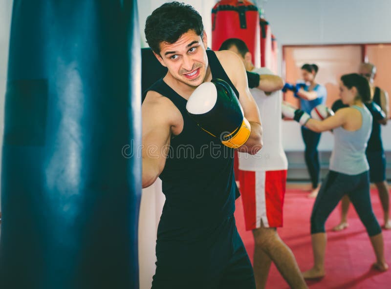 Active Sportsman in the Boxing Hall Practicing Boxing Punches Wi Stock ...