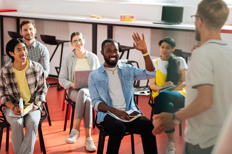 Active Student Raising His Hand and Looking Ready To Answer the ...