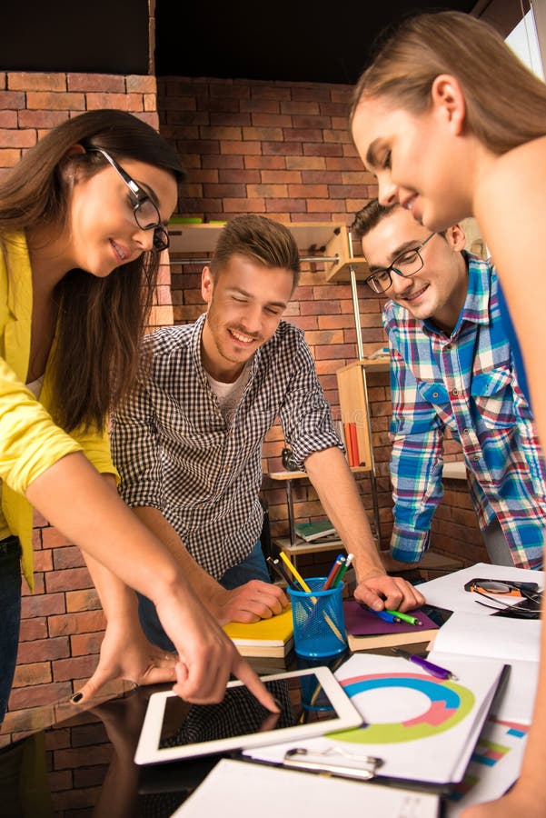 Active Team Working Together on the Task Stock Photo - Image of ...