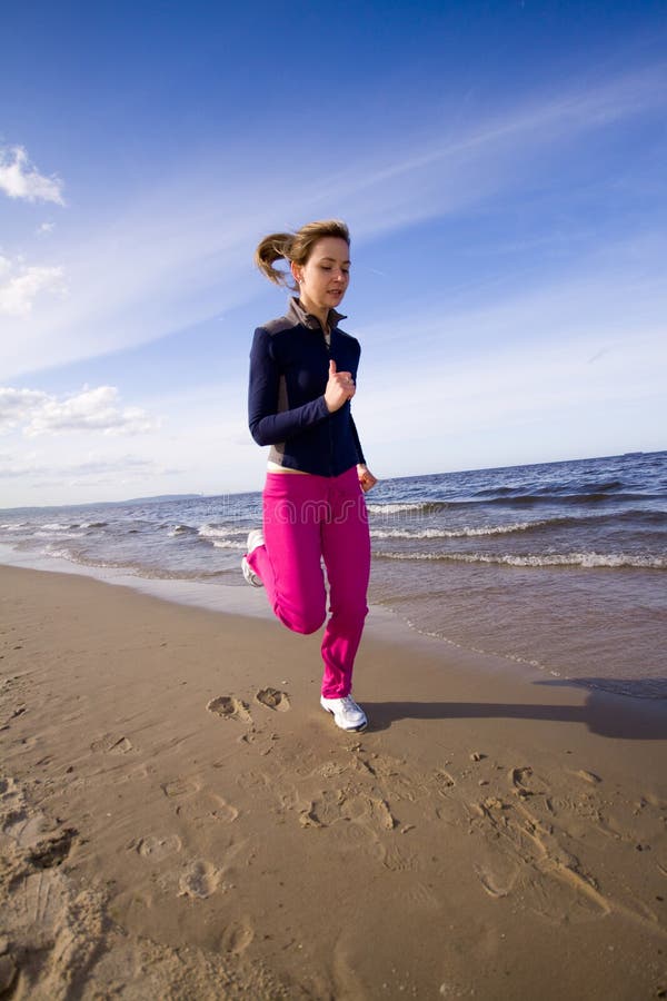 Active woman on the beach stock image. Image of action - 9467037