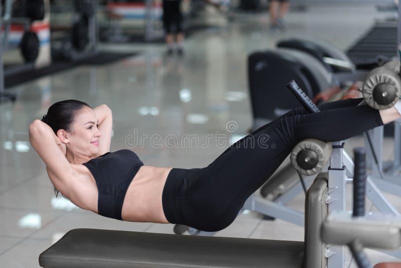 Active Woman Doing Abs Exercises in a Gym Stock Image - Image of ...