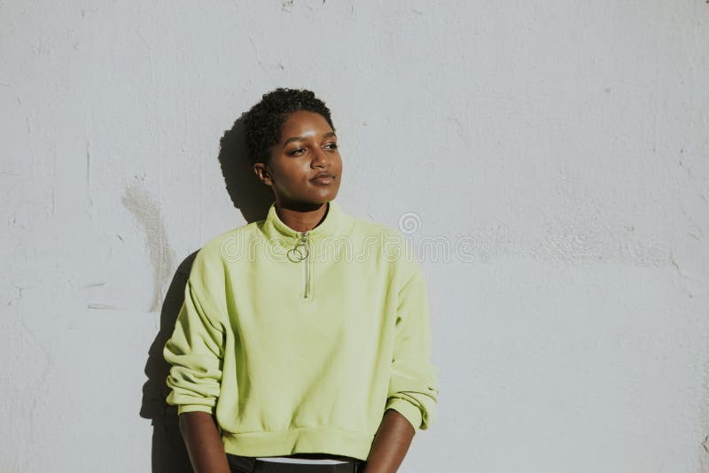 Active Woman Standing by a White Wall Stock Photo - Image of black ...