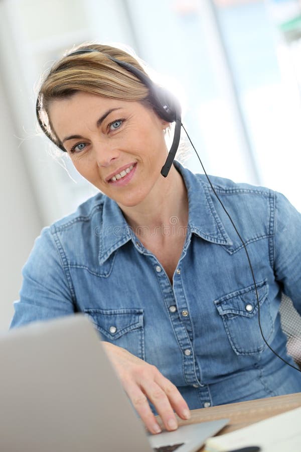 Active Woman Teleworking from Home with Headphones Stock Photo - Image ...