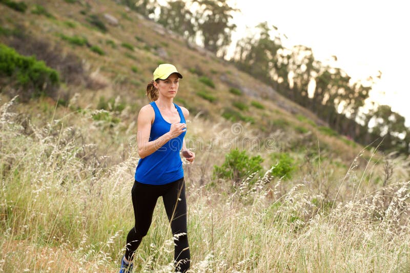 Active woman trail running stock photo. Image of motion - 71471760