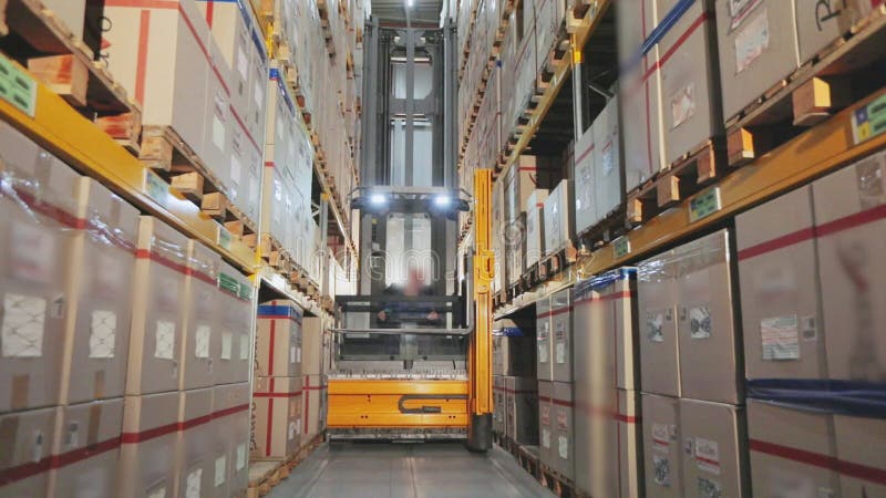 Forklift in the Warehouse Concept. Work in a Modern Warehouse Concept ...