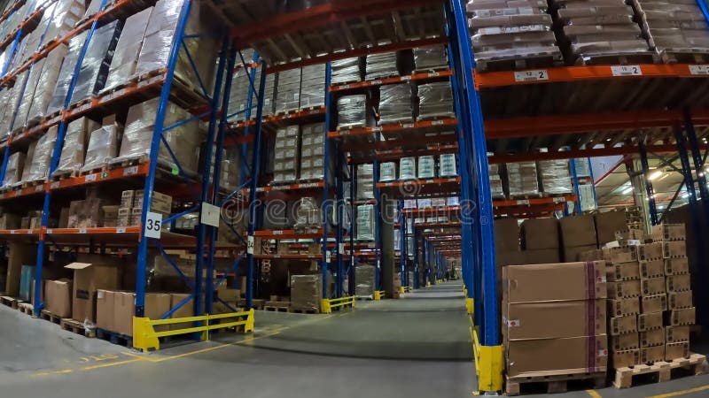 Active Work in the Warehouse. Modern Forklift Works in a Warehouse ...