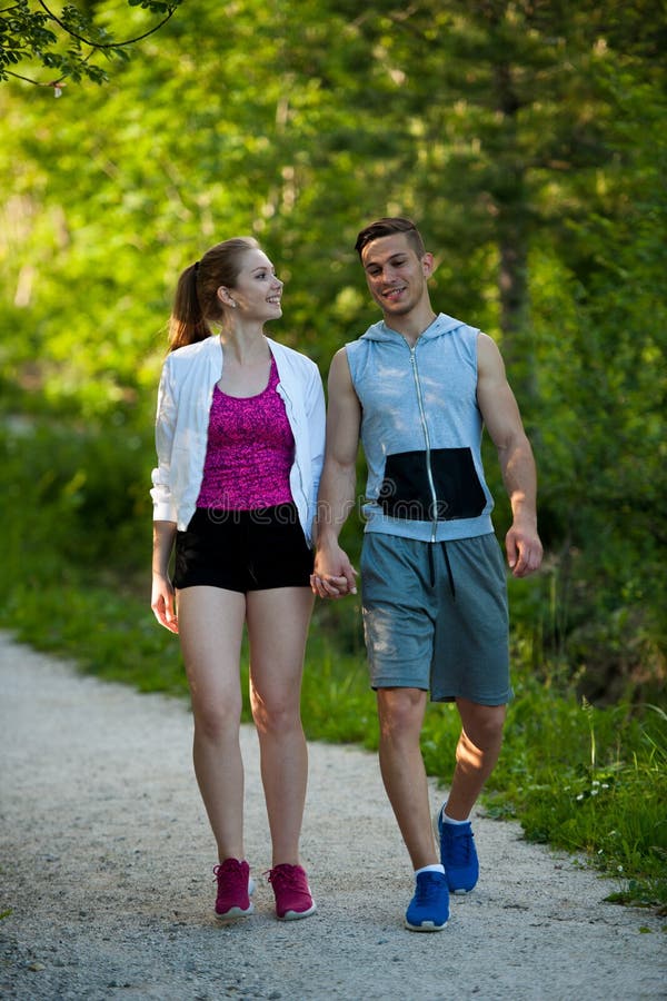 Active Young Couple on a Wlak in the Park Stock Image - Image of family ...