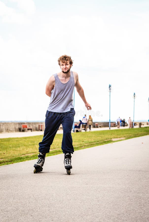 Active Young Man Rollerskating Outdoor. Stock Photo - Image of ...