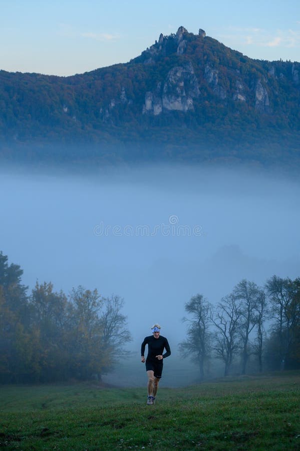 Active Young Man, Runner Train in Misty Autumn Nature. Grey Color Tone ...