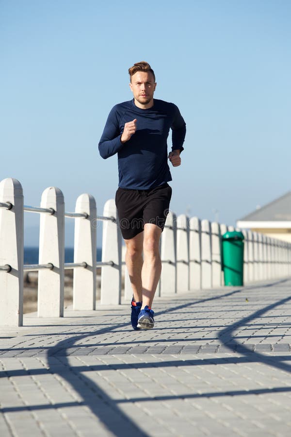Active Young Man Running Outside Stock Image - Image of fitness ...