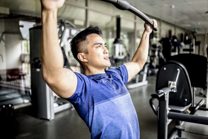 Young Man Working Out in Gym Pecs Exercise Stock Photo - Image of club ...