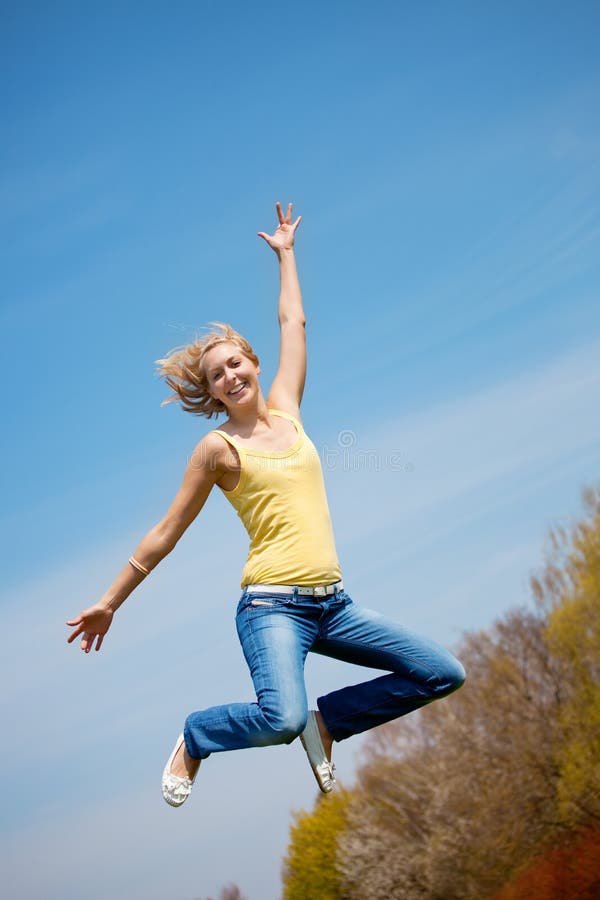 Active Young Woman Jumping High in Sunshine Stock Image - Image of ...