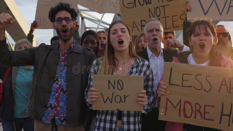 Crowd Protesting Against War, Asking for less Arms and More Hugs Stock ...