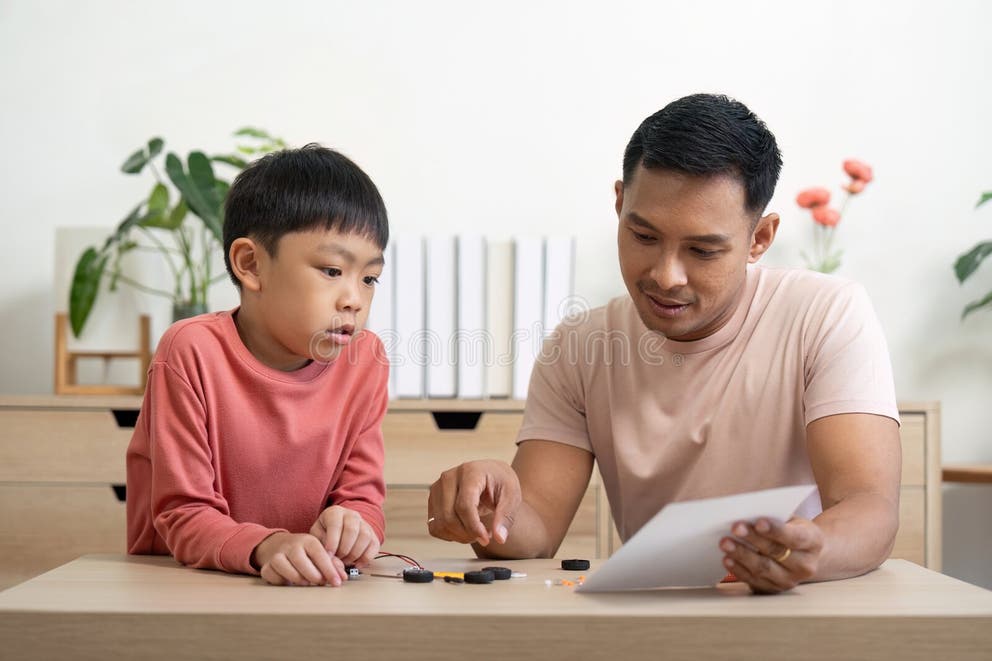 Activity of Father Teaching Son through Hands-on Project Exploration Stock Photo - Image of ...