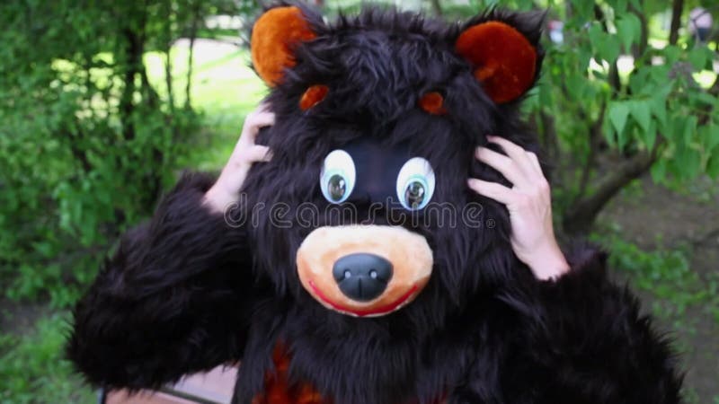 Actor Animator Puts Bear Head Sitting on Bench in Stock Footage - Video ...