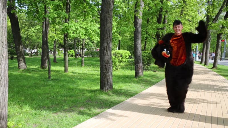 Actor Dressed As Bear Walks by Pathway in Park and Stock Video - Video ...