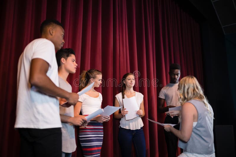 Actors Reading Their Scripts on Stage Stock Photo - Image of group ...