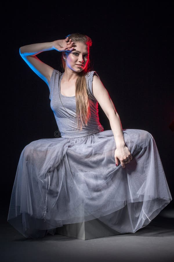 Actress in a Grey Dress on a Dark Stage Stock Image - Image of ...