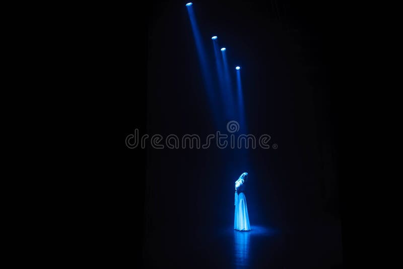 Actress, Singer on Stage in the Rays of Blue Light. Stock Image - Image ...