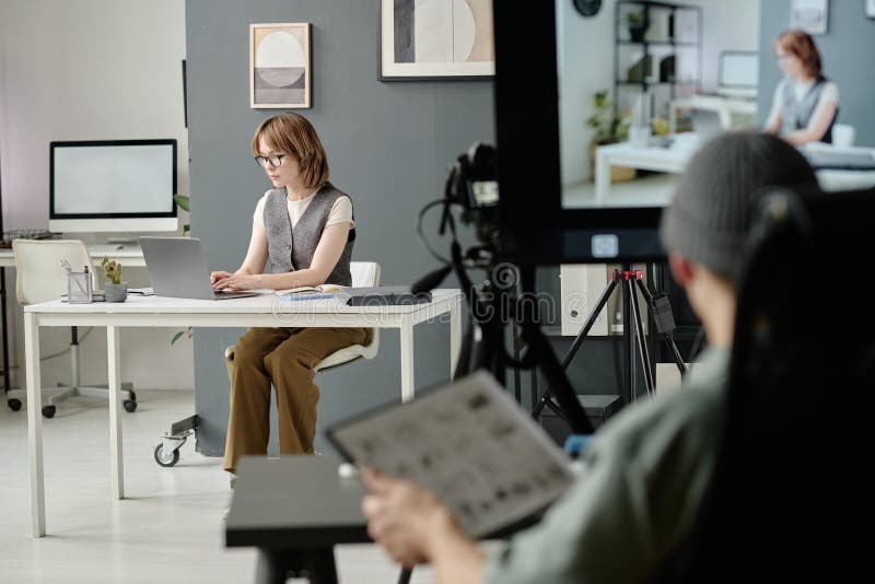 Actress Sitting at Table while Director Watching Her Stock Image ...