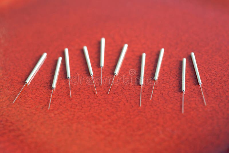 Acupuncture needles on red stock photo. Image of alternative - 10940666