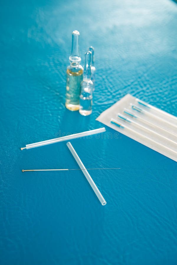 Acupuncture Needles Set and Blister on Blue Stock Photo - Image of body ...