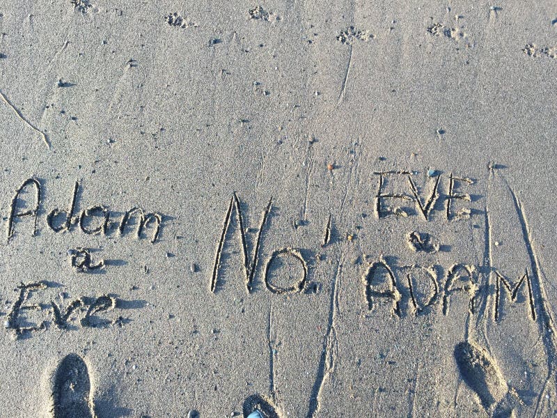 Adam & Eve - Writing in the Sand Stock Photo - Image of sentences ...
