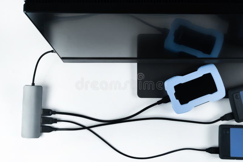 Adapter with External Hard Drives on a White Background.Many Different ...