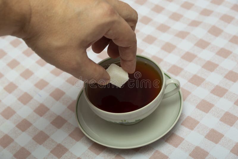 Add a Cube of White Sugar To a Cup of Tea Stock Image - Image of ...