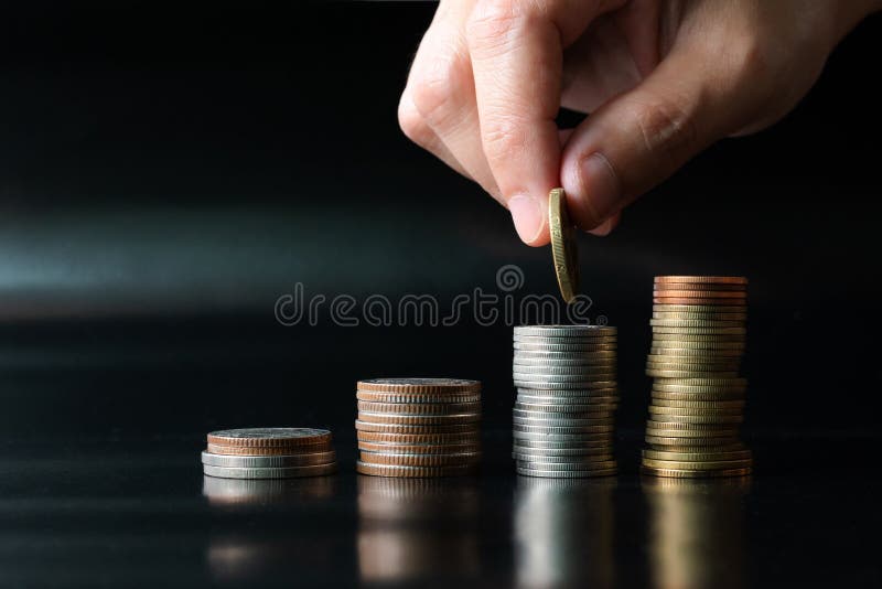 Add Saving Coin To Top of Coin Stack, Money Saving Concept Stock Image ...