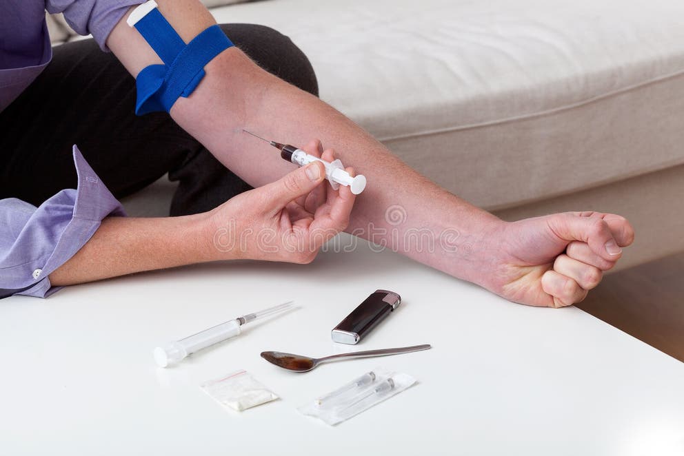 Addict making an injection stock image. Image of filling - 37687475