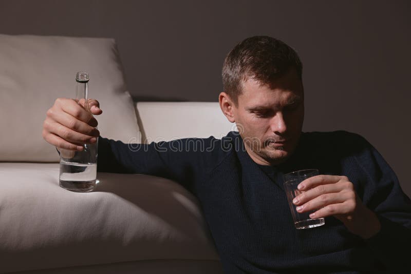 Addicted Man with Alcoholic Drink Near Sofa Indoors Stock Photo - Image ...
