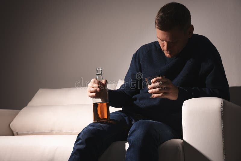 Addicted Man with Alcoholic Drink on Sofa Indoors Stock Photo - Image ...
