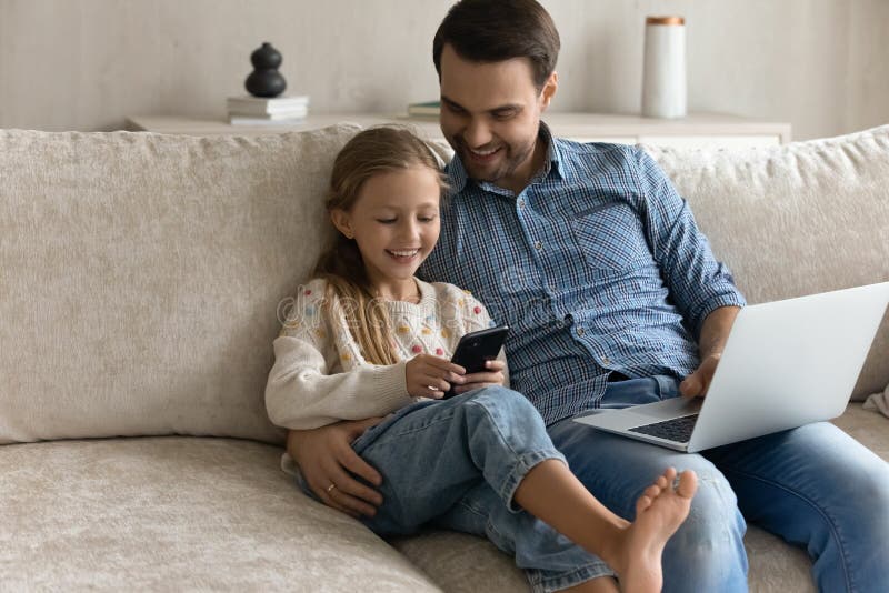 Addicted To Modern Tech Happy Family Using Different Gadgets. Stock ...
